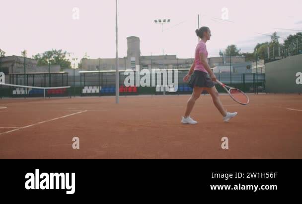 Attractive Athlete Poses Near Net In Tennis Court. Young athletic ...