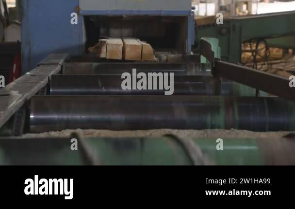 Sawing machine at wood production factory. Timber material processing ...