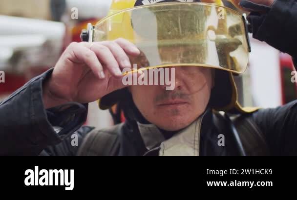 Close up portrait of standing next to fire van with flashing lights on ...
