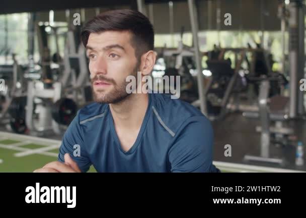 Handsome young athlete Asian guy exercise doing squat fat burning ...