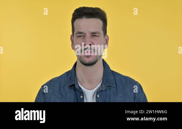 Portrait of Upset Young Man Crying at Camera, Yellow Background Stock ...