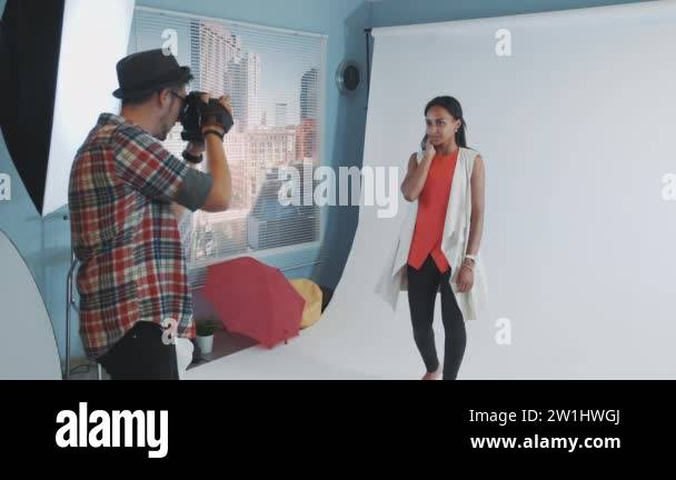 Backstage of photo shoot: multiracial young woman posing for fashion ...