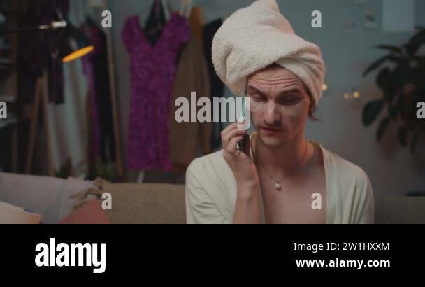 Close up of transgender man aggressively talking on smartphone and ...