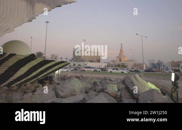 Corniche street in Doha Qatar sunset shot showing The Pearl (oyster ...