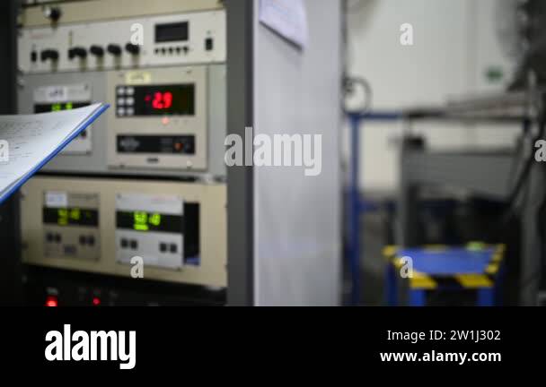 Electrical engineer man checking voltage at power distribution cabinet in control room Stock ...