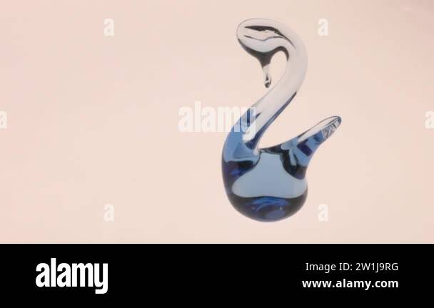 Artificial swan made of transparent blue glass. Used as a talisman - a ...