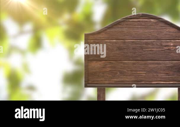 wooden sign pointer on animated background of foliage and sun glare ...