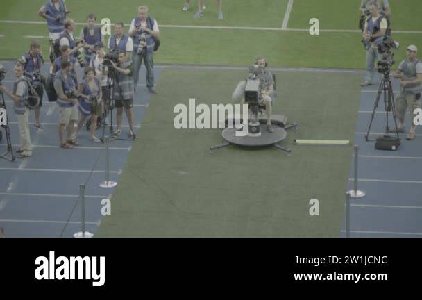 Cameraman with a camera in the stadium during a football match. TV ...