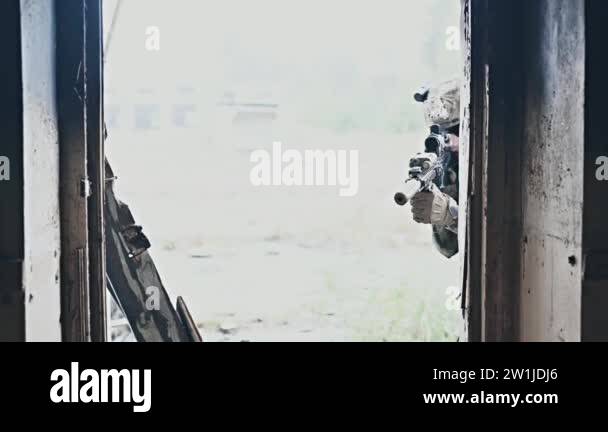 Soldier in combat. Urban combat training, soldier entering abandoned ...