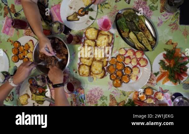 Asian cuisine, simple food. Hands of people take prepared dishes from ...