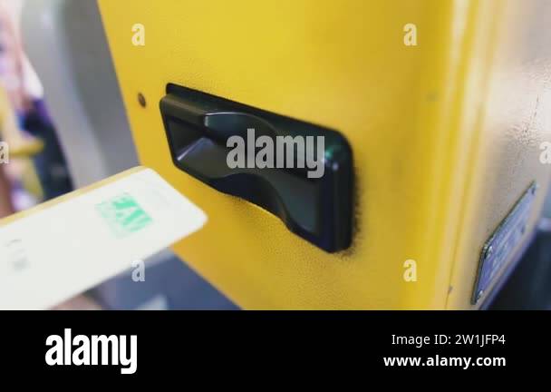 Public transport. An electronic composter punches a ticket Stock Video ...