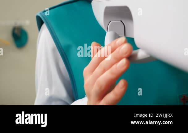 Dental Ct scanner in modern dental clinic. Close-up shot of female hand ...