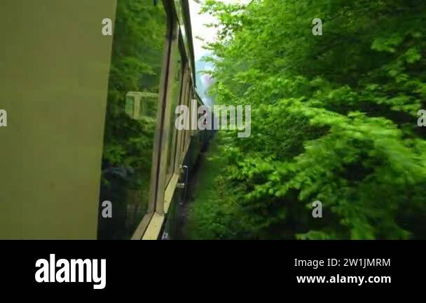 view from the window of a retro train wagon, Old steam locomotive in ...