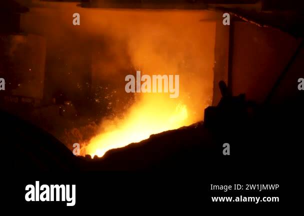 Close up of the process of hot steel production at the steel melting ...