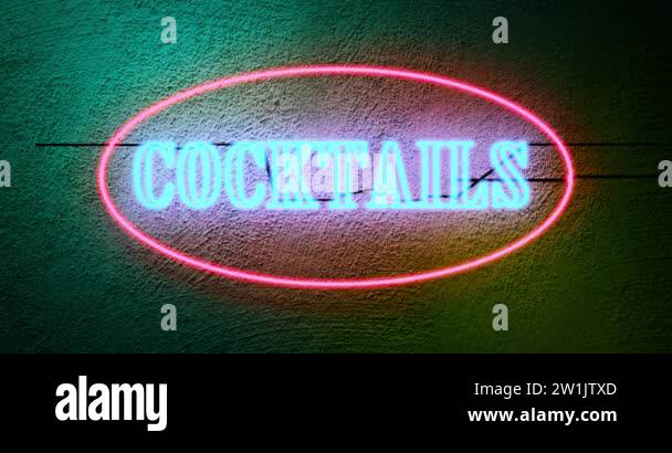 Neon cocktails sign outside tropical bar shows nightclub entrance ...
