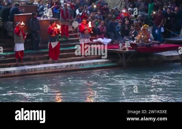 Static shot of Priests doing Ganga Pujan(Ganga Aarti) worshipping the ...