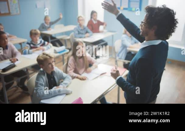 Elementary Classroom of Diverse Bright Children Listening to Teacher ...