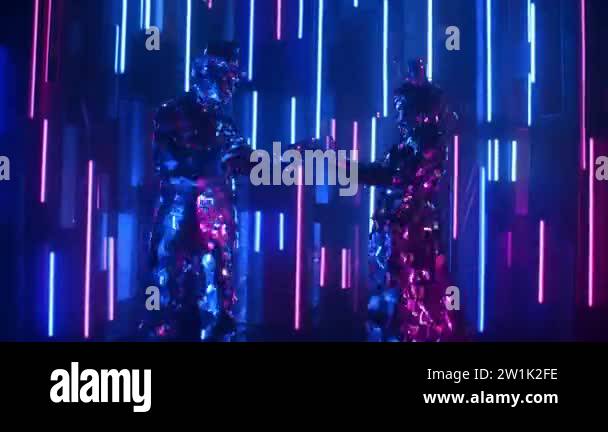 Neon light couple metallic shiny couple dancing together. Modern glass ...