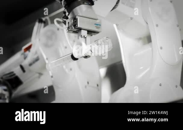 The innovative arms of a robotic arm make an injection of chemotherapy for a cancer patient. New ...