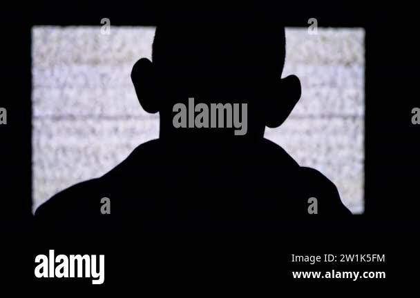 Silhouette of an Anonymous Mans Head is Watching White Static Noise and ...