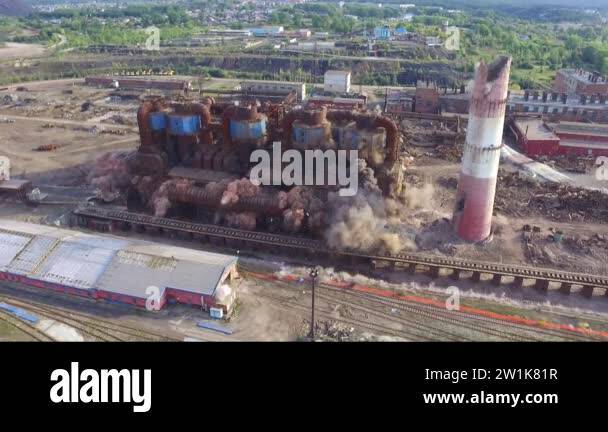 The collapse of an obsolete industrial chimney with an explosion ...