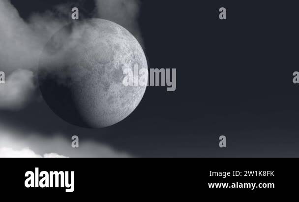 Animation of illuminated moon partially covered by moving clouds on ...