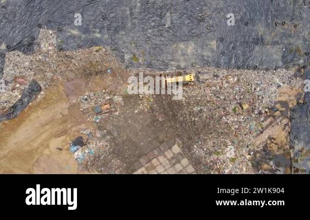 Aerial top view video of a solid waste landfill. City waste treatment ...