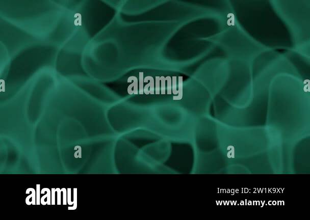 Smoke changing colors from blue to green on black background. Abstract ...