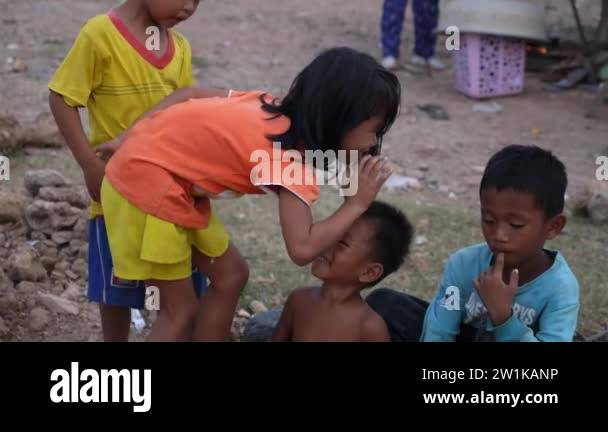 Cute Kids Playing On Street in Slums In Poverty Stock Video Footage - Alamy