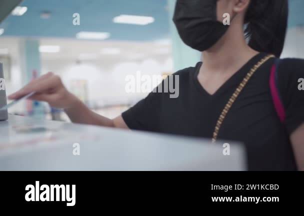 Young Asian woman hand in travel documents, ID card, passport to check ...