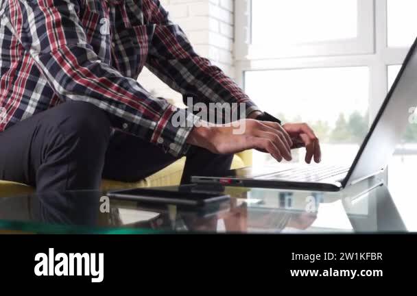 Close-up of hands typing on keyboard. Young man freelancer student ...