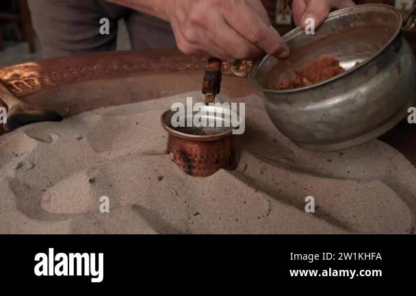 Turkish coffee making video. Turkish coffee brewing process in the sand ...