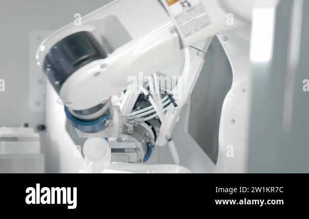 Robotic arm makes an injection with chemotherapy medicine. Two ...