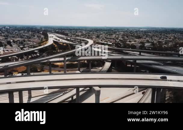 drone flying right over multiple levels of epic highway junction ...