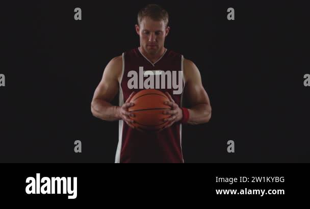 Portrait of a muscular Caucasian male basketball player wearing team ...