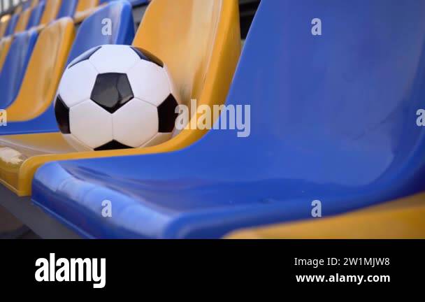 Black And White Soccer Ball On A Plastic Seat. Empty Rows And Seats Of ...