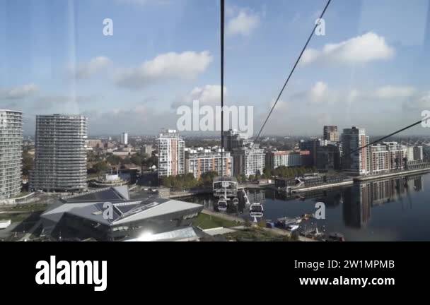 Picturesque city view from inside of teleferic cabin. Action. Landscape ...