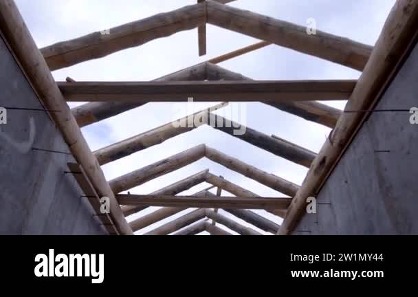 Bottom view of wooden truss system, construction of house roof on ...