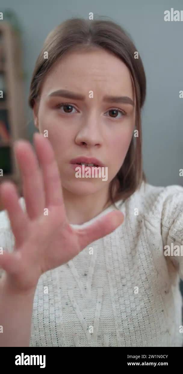 Pretty female person having video call and showing with sign language ...