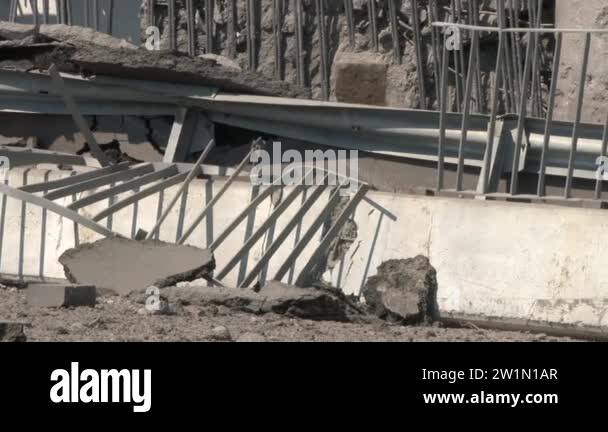 Close-up of metal bars destroyed after an explosion or earthquake ...