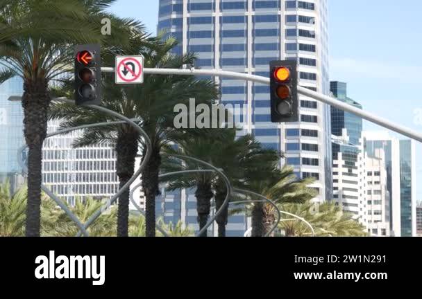 Traffic light and caution sign, road intersection in USA ...