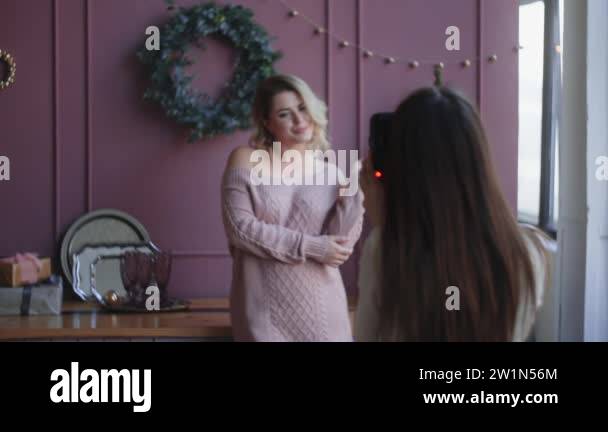 Beautiful woman poses to the photographer at the christmas photoshoot ...