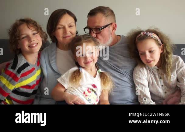 Close portrait of a big happy family. Grandparents are sitting on the ...
