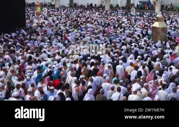 Static top view of Muslim pilgrims circumambulate (or tawaf) the Kaabah ...