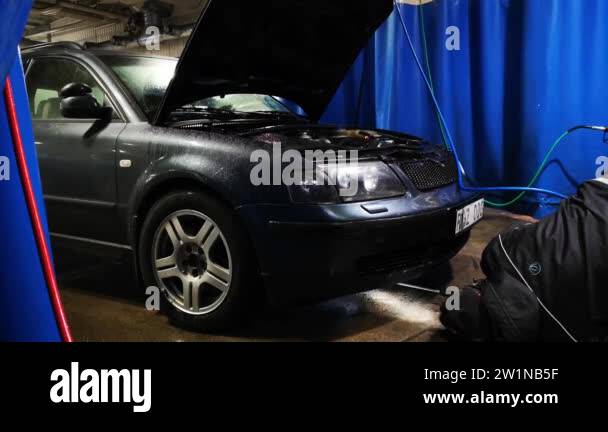 Self service car wash. Man washing his car at automobile washing ...