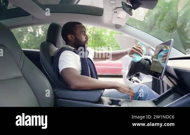 Side view of handsome attantive young bearded black-skinned man which ...