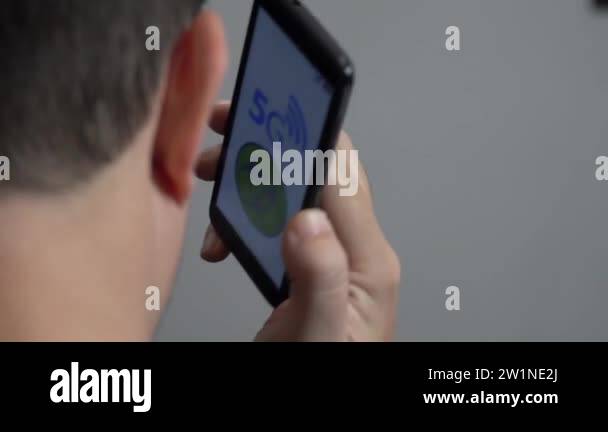 5g network danger concept. Man putting a smartphone to his ear. Back ...