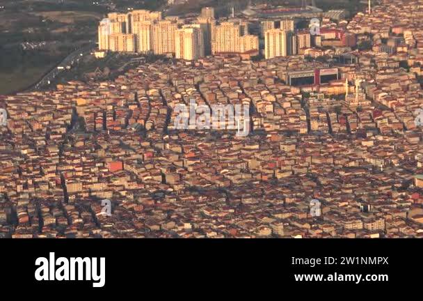 Overpopulated metropolis. Crowded congested city from airplane. Mosques ...