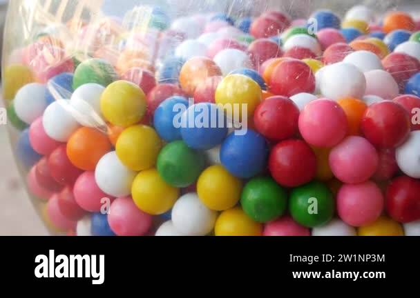 Colorful gumballs in classic vending machine, USA. Multi colored buble ...