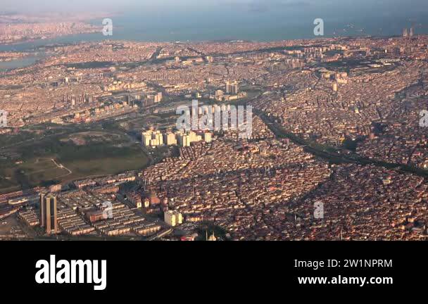 Overpopulated metropolis. Crowded congested city from airplane. Mosques ...